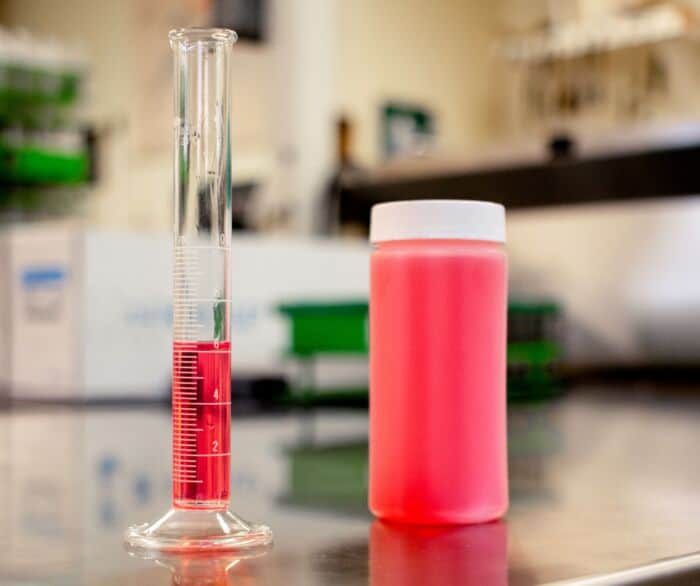 Red Fuel And Graduated Cylinder | Blackstone Laboratories